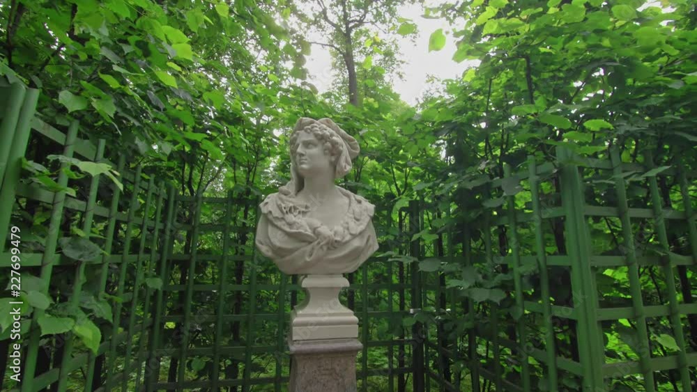 Statue of Greek mythology in Summer Garden park, sunny trees in the ...