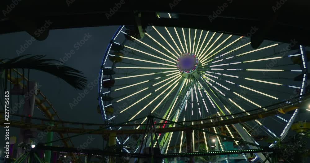Santa Monica Pier ferris wheel and roller coaster. Pictures display on ...