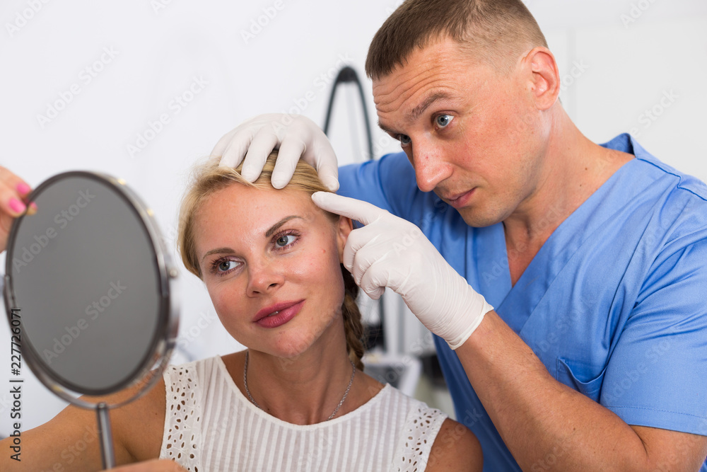 Man doctor is preparing female patient to procedure Stock Photo | Adobe ...