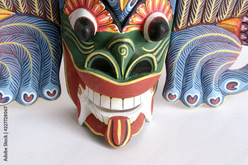 Traditional Indonesian (Balinese) mask-souvenir from a tree isolated on ...