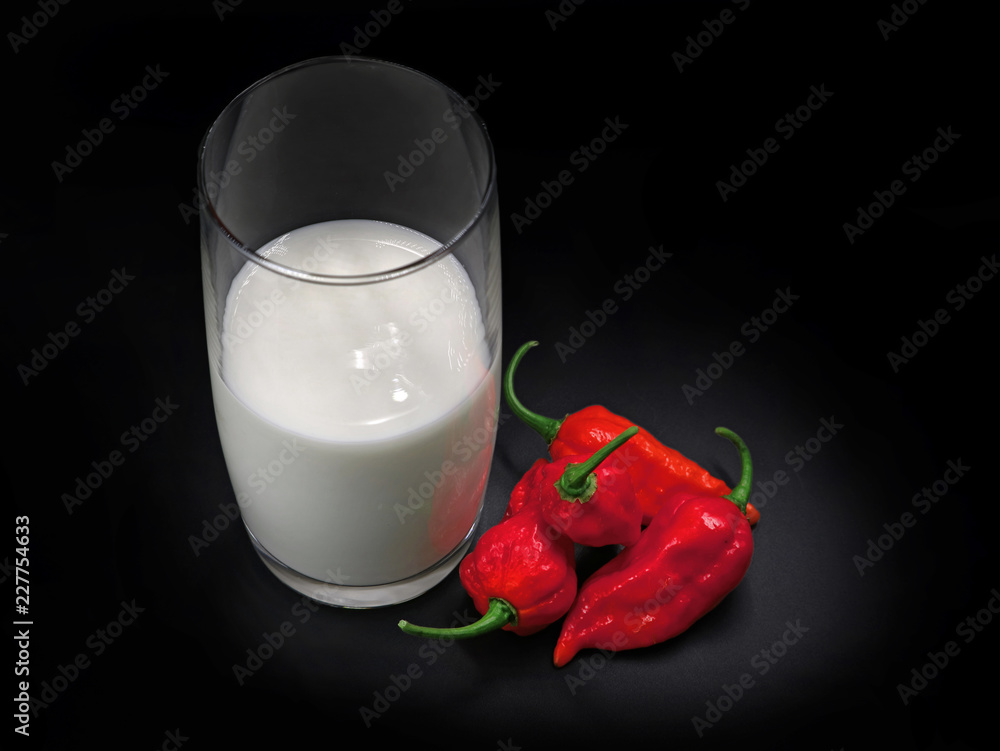 one of worlds hottest chili peppers bhut jolokia and a glass of milk on ...
