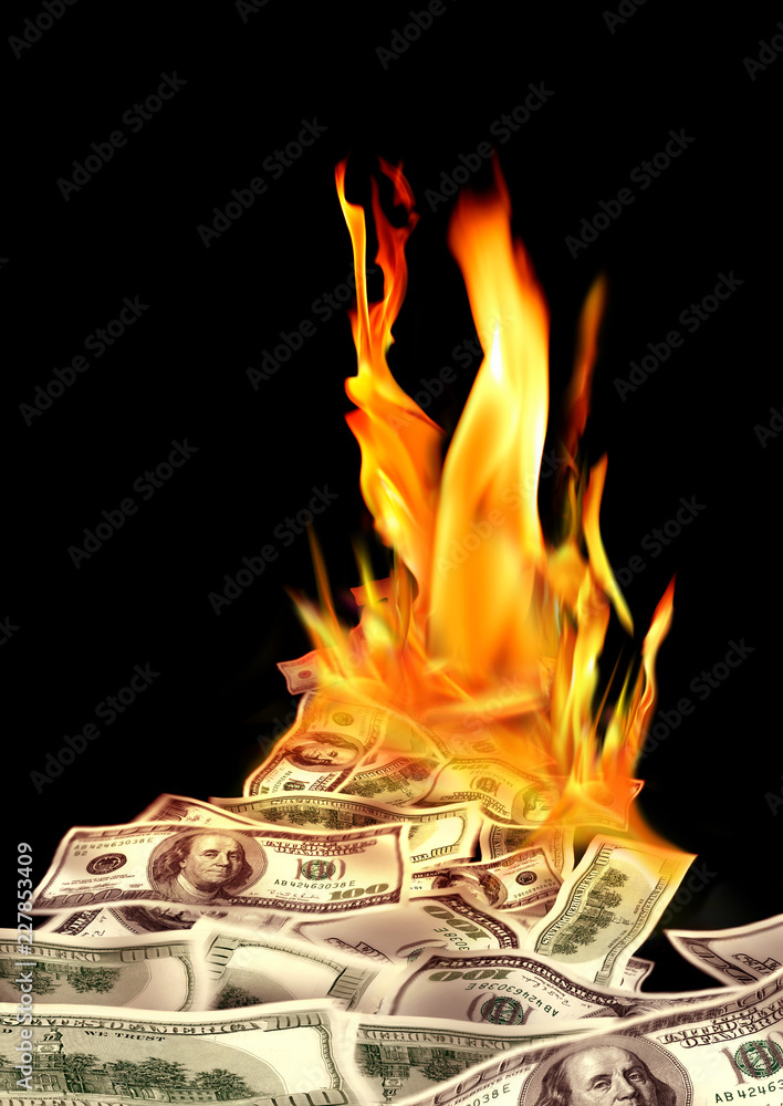 Conceptual finance image of burning pile of money, dollar bills, and ...