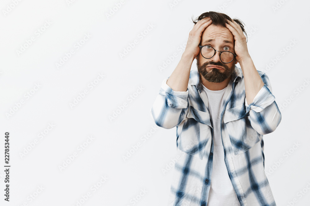 Why me. Portrait of upset and gloomy poor adult man with beard and ...