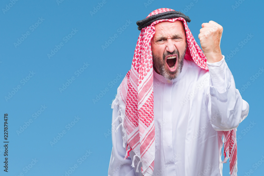 Senior arab man wearing keffiyeh over isolated background angry and mad ...