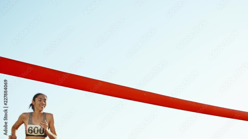 Female athlete on track. Young asian runner runing on track of stadium ...