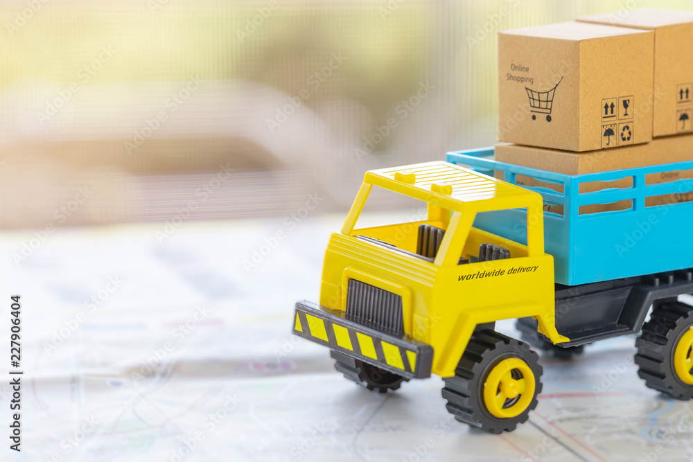 Transport truck with cardboard box with symbols, shopping cart, up ...