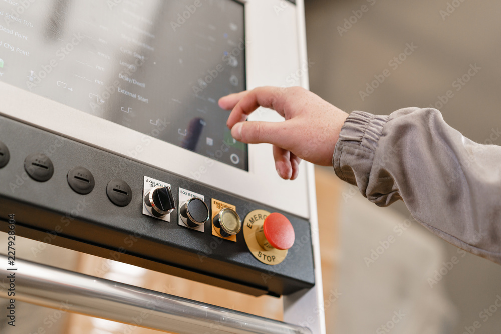 control computer display of Machine. Manufacture workers adjusts the ...
