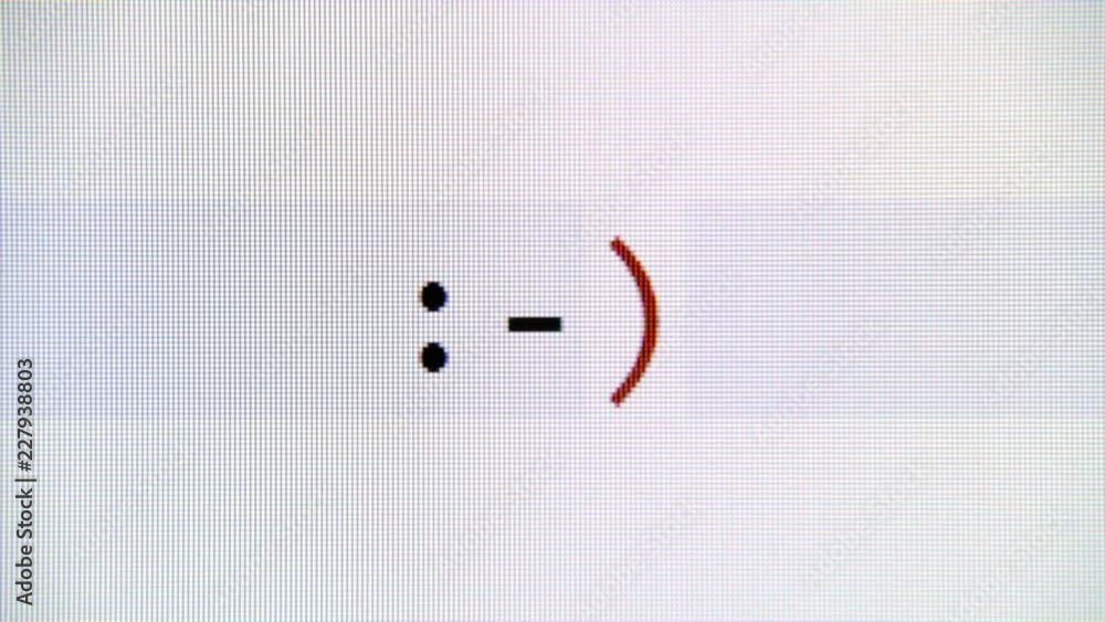 Typing the emoticon smile (a representation of a facial expression ...