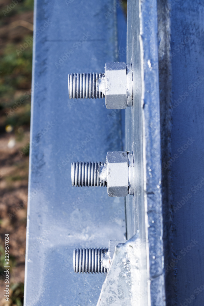 fasten bolts twisted with a nut and hold the metal plate Stock Photo ...