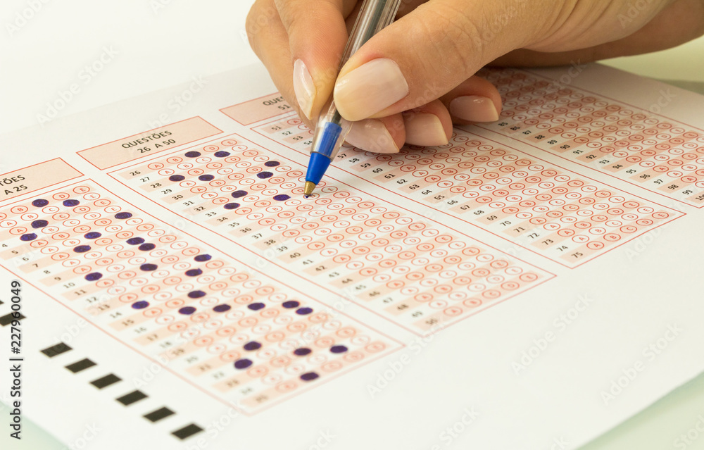 Foto de Education and concept. Student. Female hand with pen filling ...