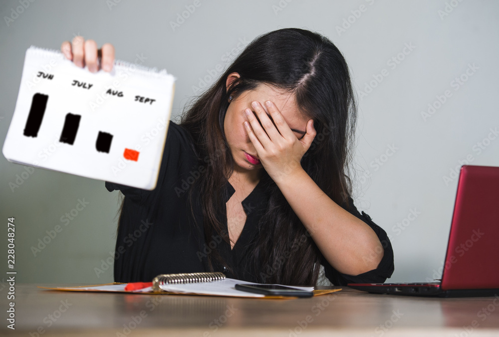 frustrated business woman executive suffering depression holding graph ...