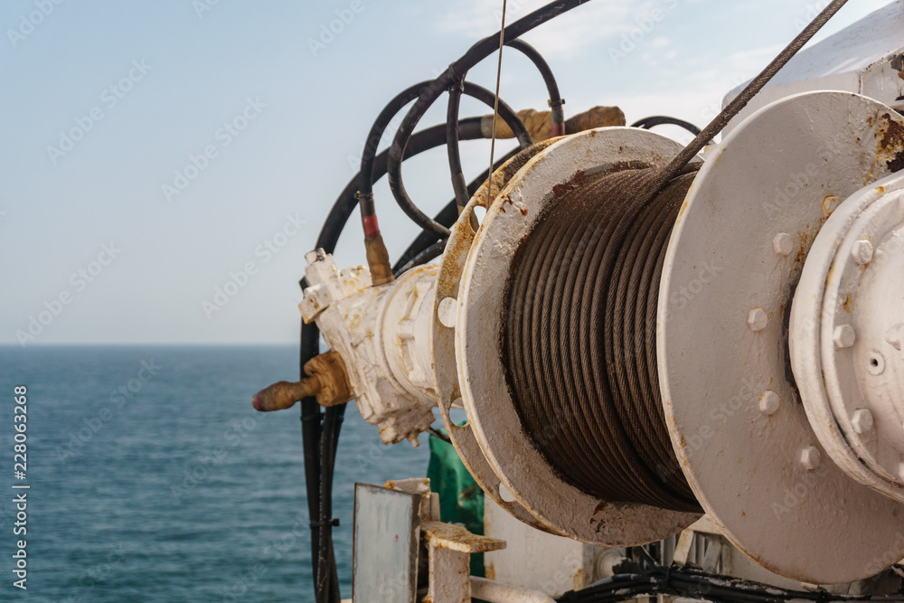 old crane with rusty wire coil on a ferry Stock Photo | Adobe Stock