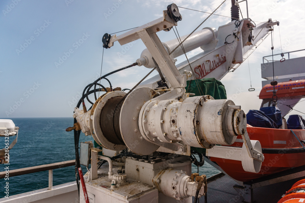old crane with rusty wire coil on a ferry Stock Photo | Adobe Stock