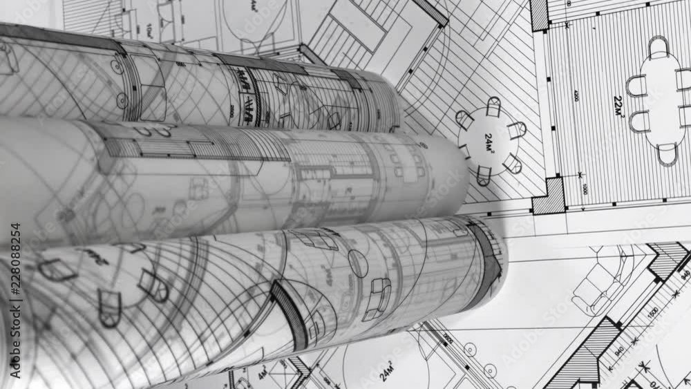 Blueprints - rolls of architectural drawings smoothly rotate on the ...