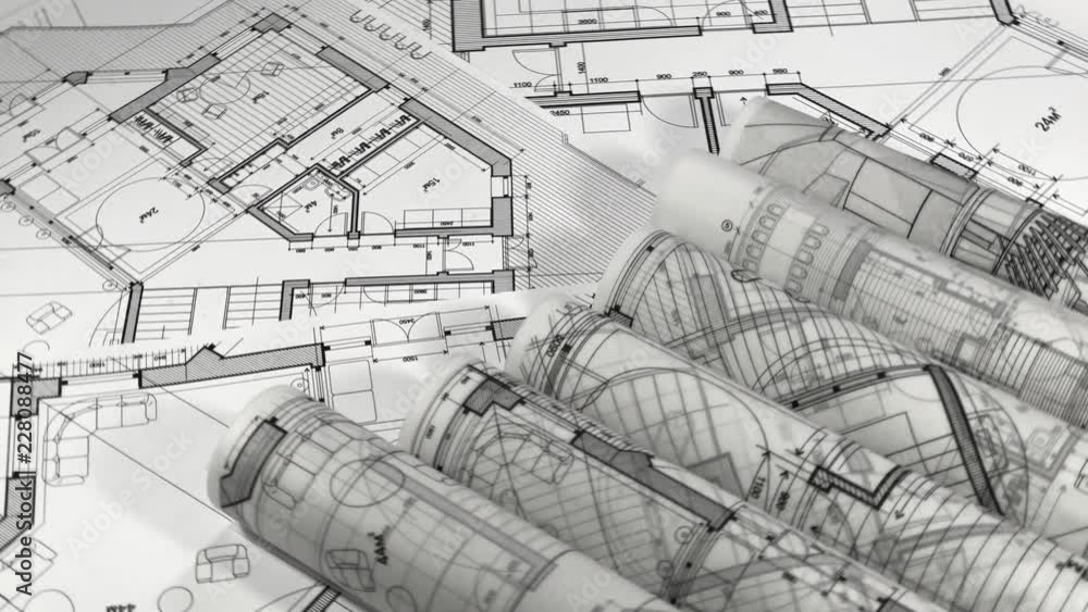 Blueprints - rolls of architectural drawings smoothly rotate on the ...
