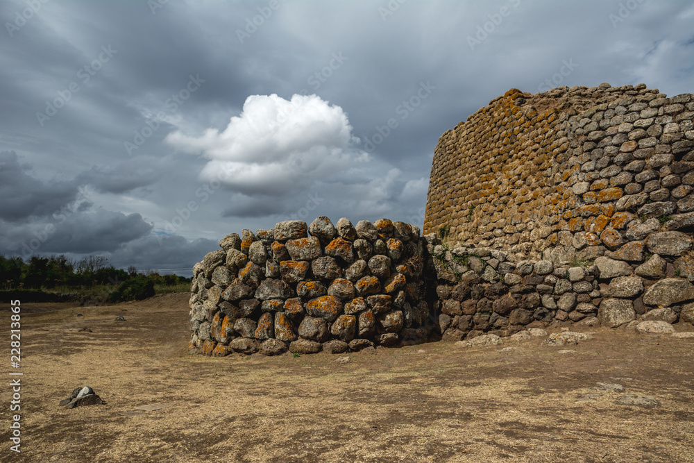 Typical nuraghe site in Sardinia, Italy with picturesque clouds before ...
