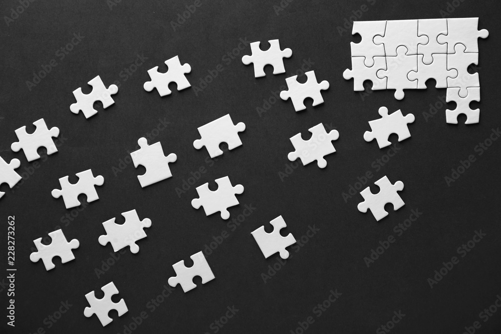 Incomplete jigsaw puzzle on color background Stock Photo | Adobe Stock