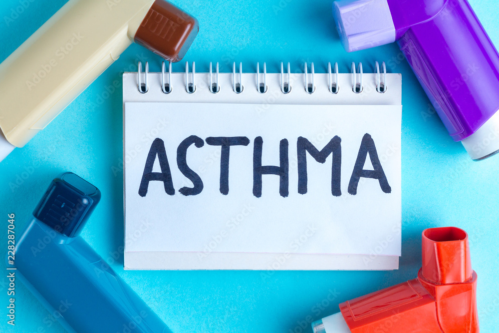 Various asthma inhalers on a blue background. Asthma and copd disease ...