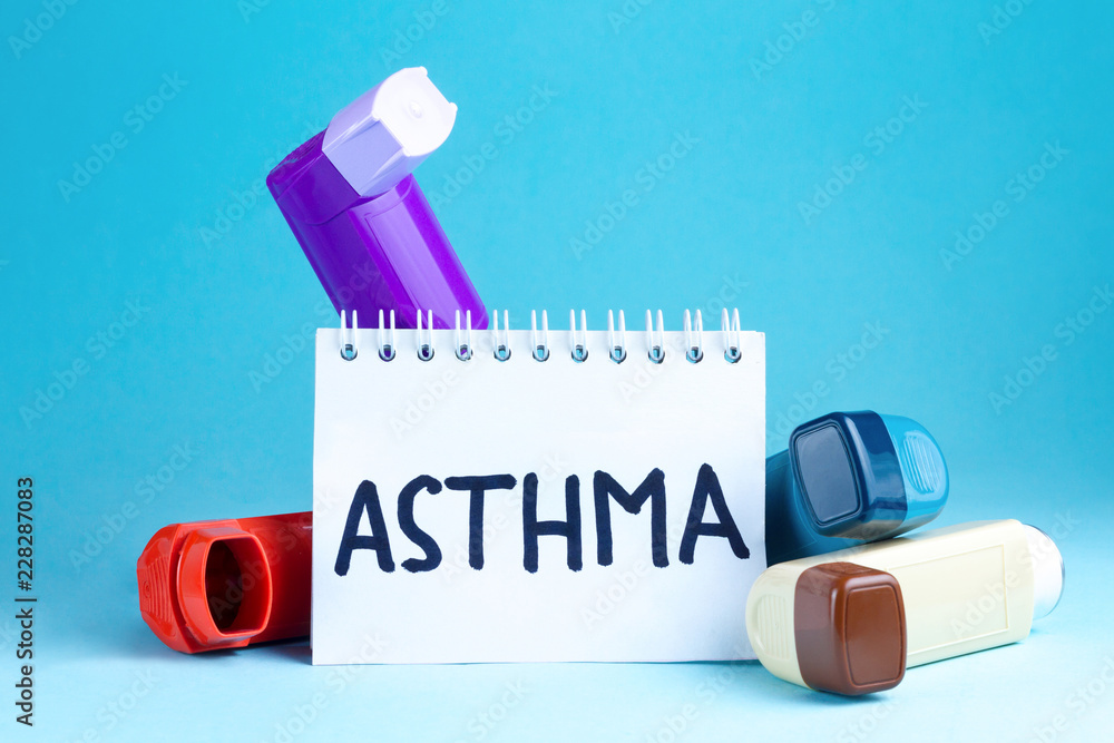 Various asthma inhalers on a blue background. Asthma and copd disease ...