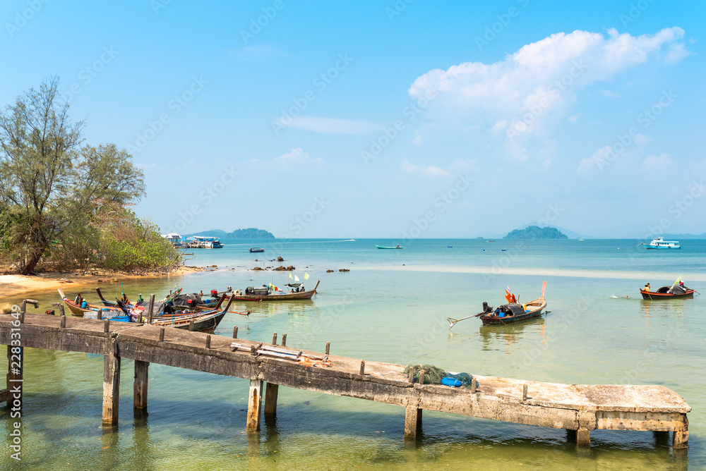 Sea Gypsies on their long-tail boats at the east side beach named Ao ...
