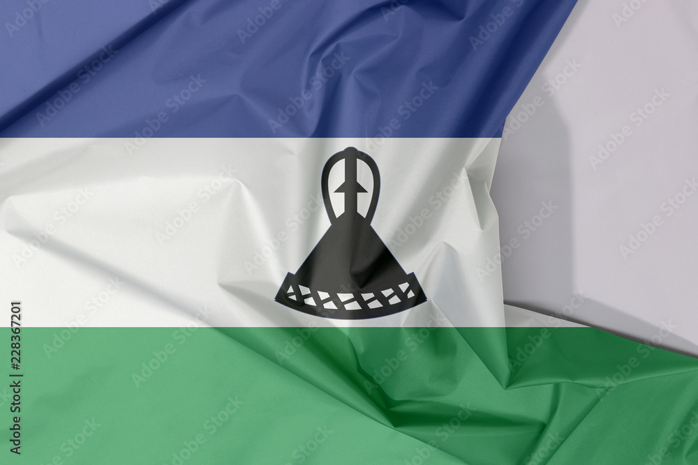 Lesotho fabric flag crepe and crease with white space, blue white and ...