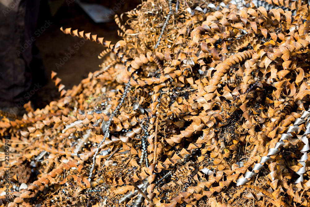 silver spirals of metal shavings as garbage, texture of different size ...
