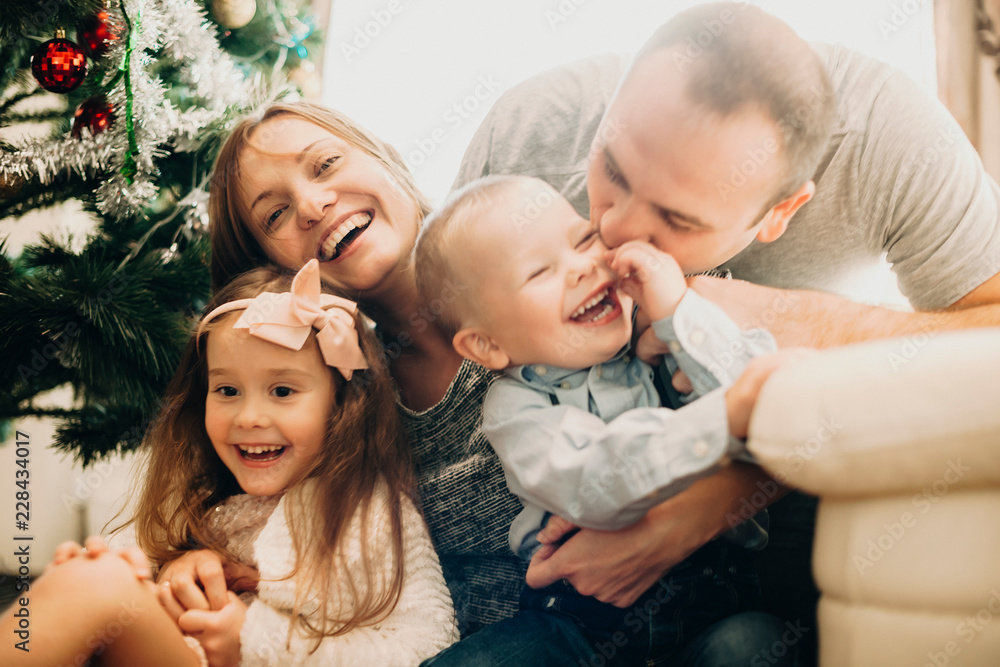 Loving family with kids embracing at home Stock Photo | Adobe Stock