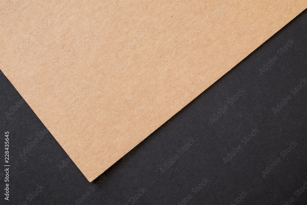 Kraft paper sheet overlap with brown and black colors for background ...