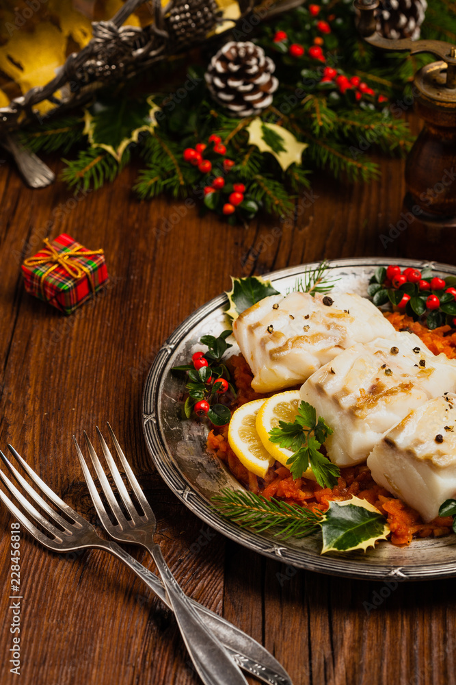 Christmas fish. Roasted cod pieces, served in vegetable sauce. Stock ...