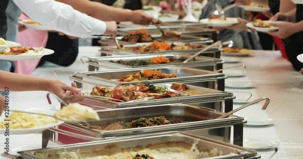 People group catering buffet food indoor in luxury restaurant with meat ...