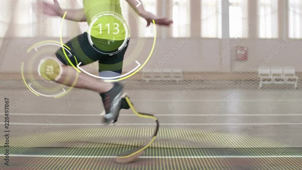 Tracking shot of paralympic athlete with prosthetic leg running on ...