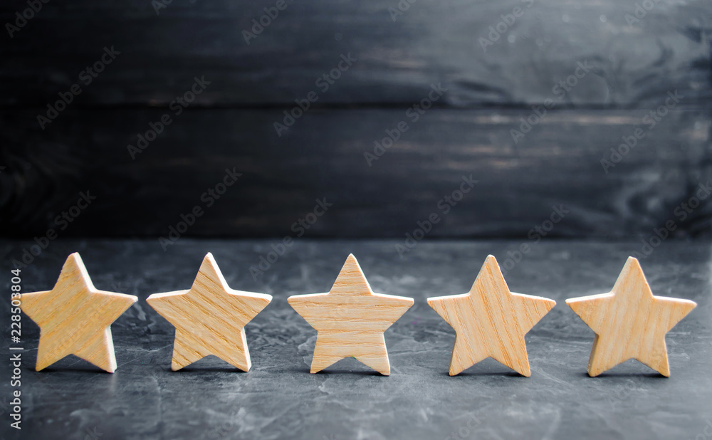 Five wooden stars. Get the fifth star. The concept of the rating of ...