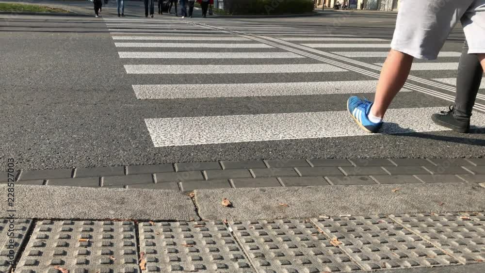 Vehicle and pedestrian traffic. Pedestrian cross over road by zebra ...