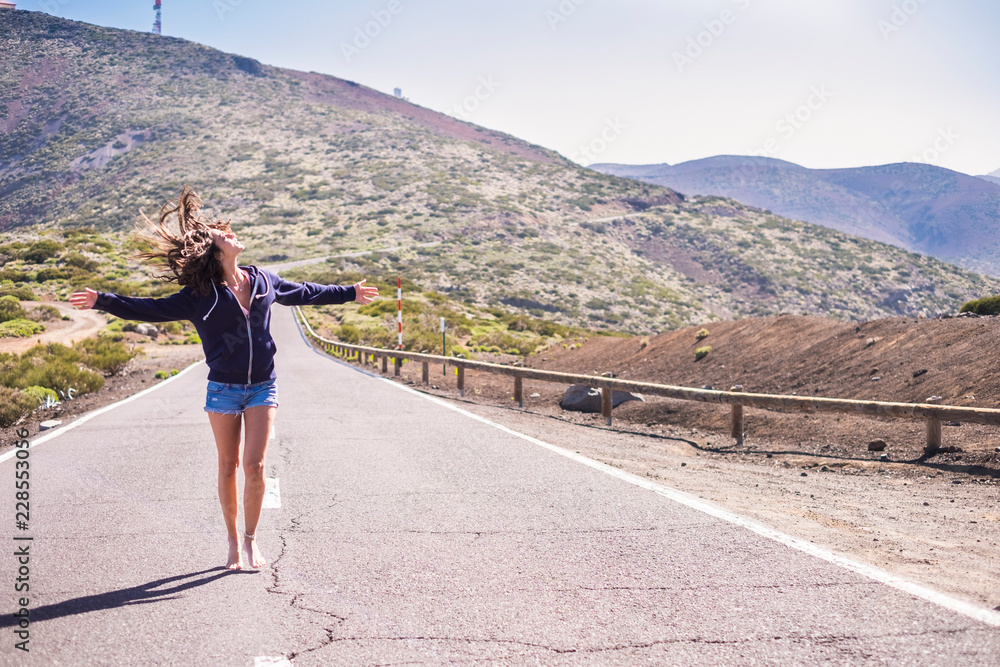 nice young caucasian woman girl walking barefoot and free in the middle ...