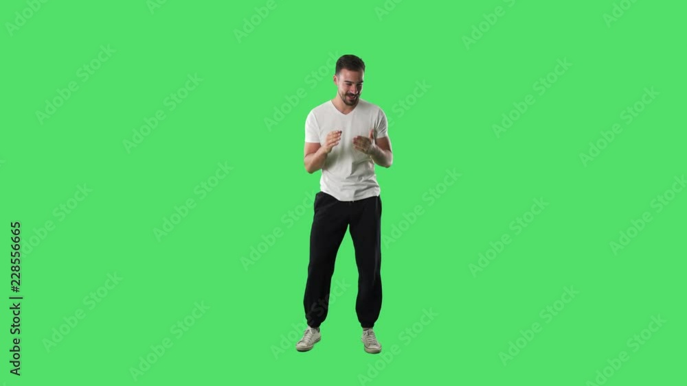 Young relaxed funny man dancing twist and making fun. Full body ...