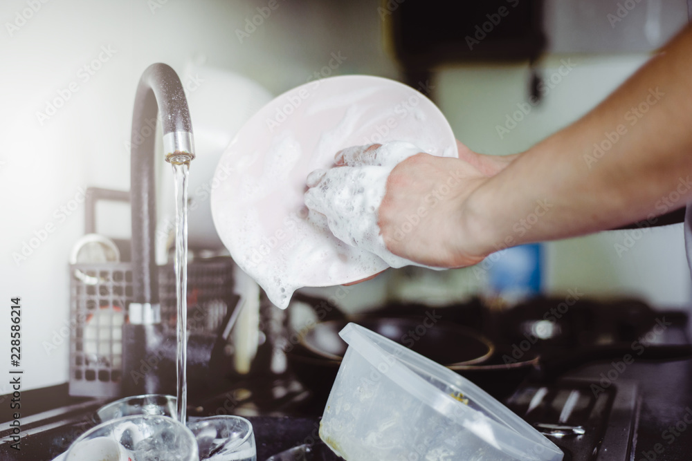Man Washing Dishes By Hand