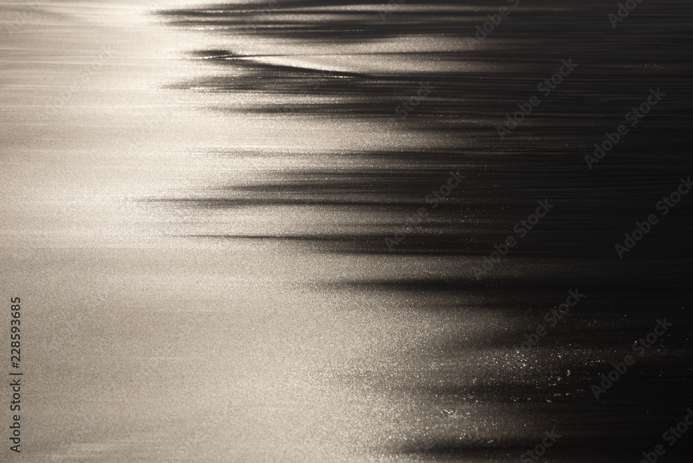 the play of light on wet sand in the evening light Stock Photo | Adobe ...