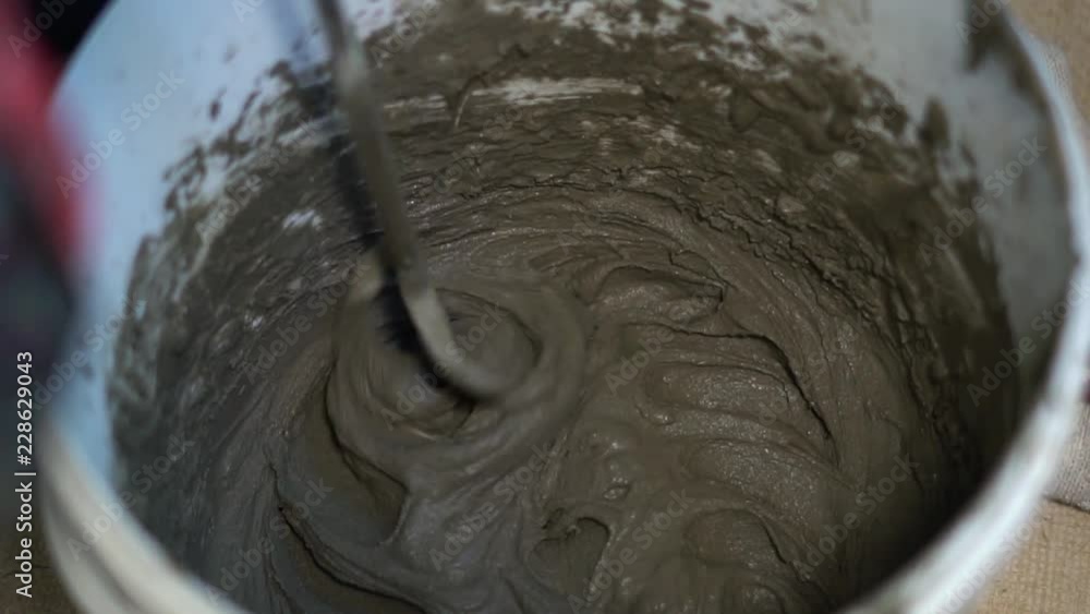 Mixing mortar concrete mix to bind ceramic tiles & membrane during ...