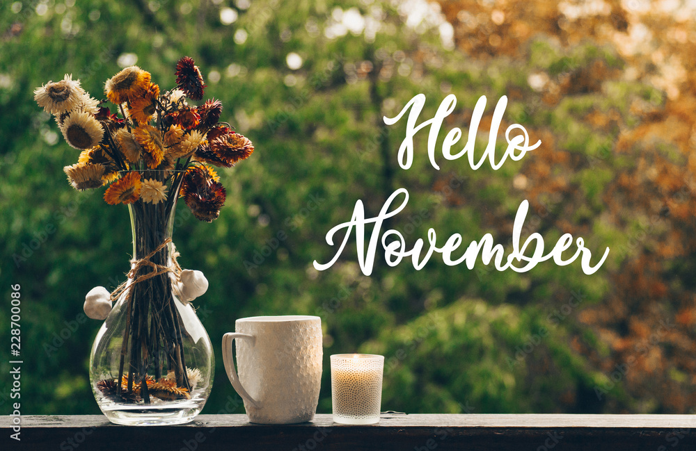 Hello November. Cozy autumn still life: cup and opened book on vintage ...