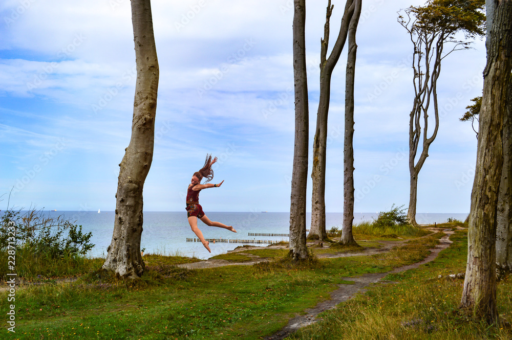 Freudensprung an der Steilküste Stock Photo | Adobe Stock