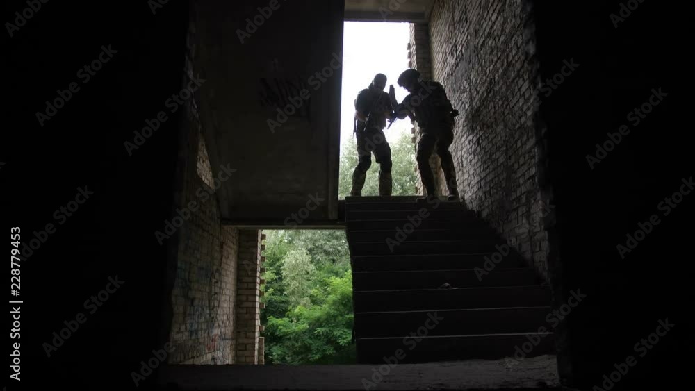 Squad of special force anti terrorist police sneaking up to the ...