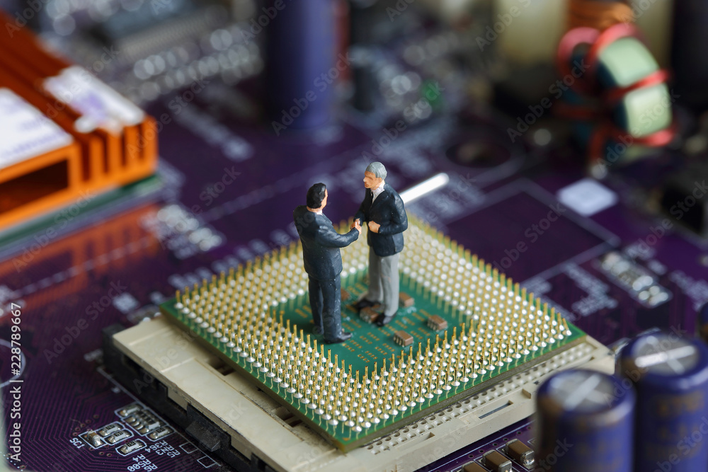 Selective focus of miniature businessman handshake on Control ...