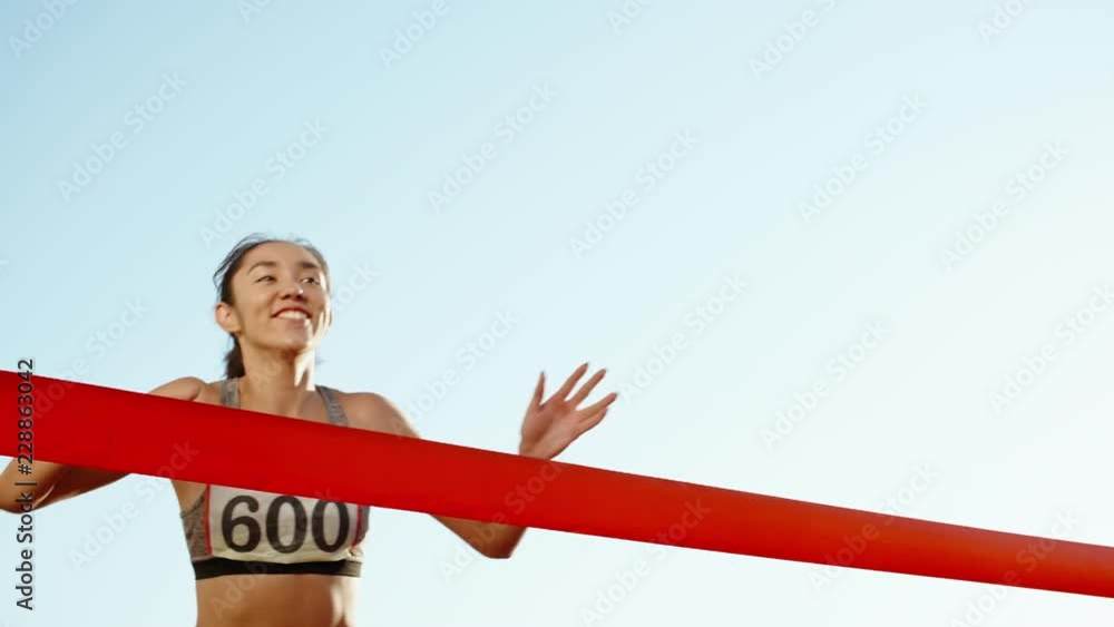 Female athlete on track. Young asian runner runing on track of stadium ...