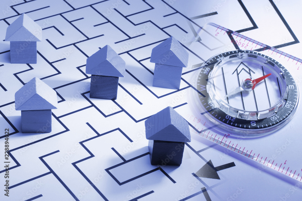 Composite of House Symbols and Compass on Labyrinth Stock Photo | Adobe ...