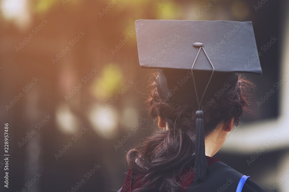 shot back side young female of graduation hats during commencement ...