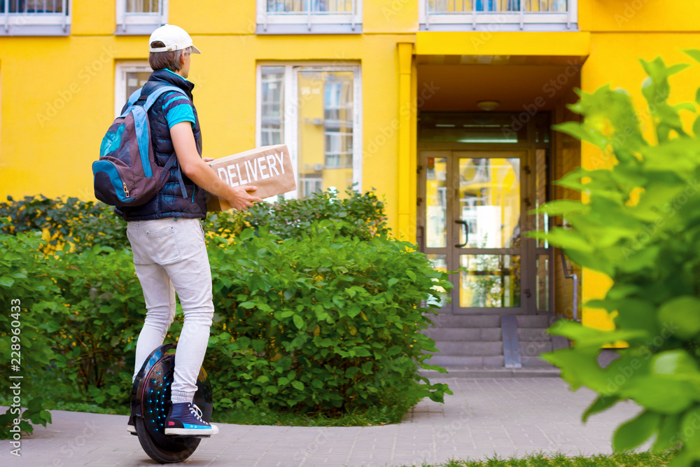 Modern future delivery. Man male guy in delivery uniform and delivery ...