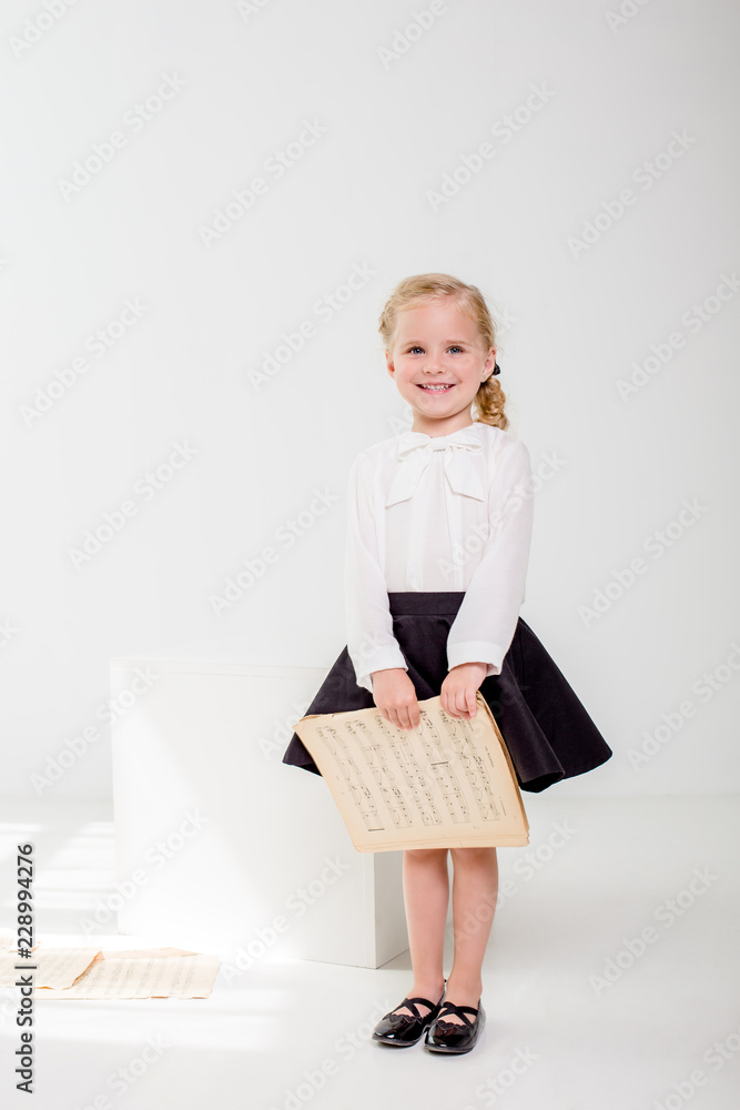 Kid model, girl in a school uniform Stock Photo | Adobe Stock