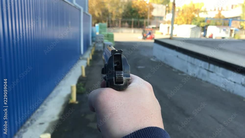 Man with gun (Makarov Soviet union) police pistol Stock 비디오 | Adobe Stock