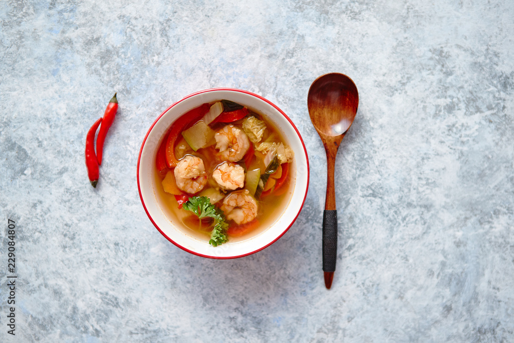 Traditional Tom Yum spicy Thai soup with shrimp, seafood, coconut milk ...