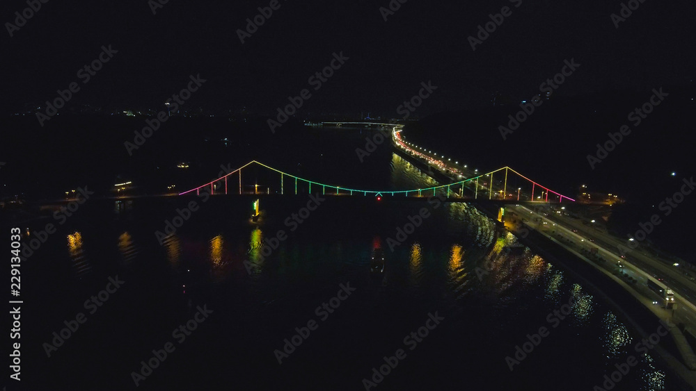 Aerial view from Drone: Top view of the night promenade with bridges ...